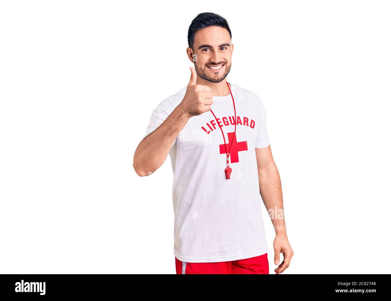 Young handsome man wearing lifeguard uniform doing happy thumbs up ...