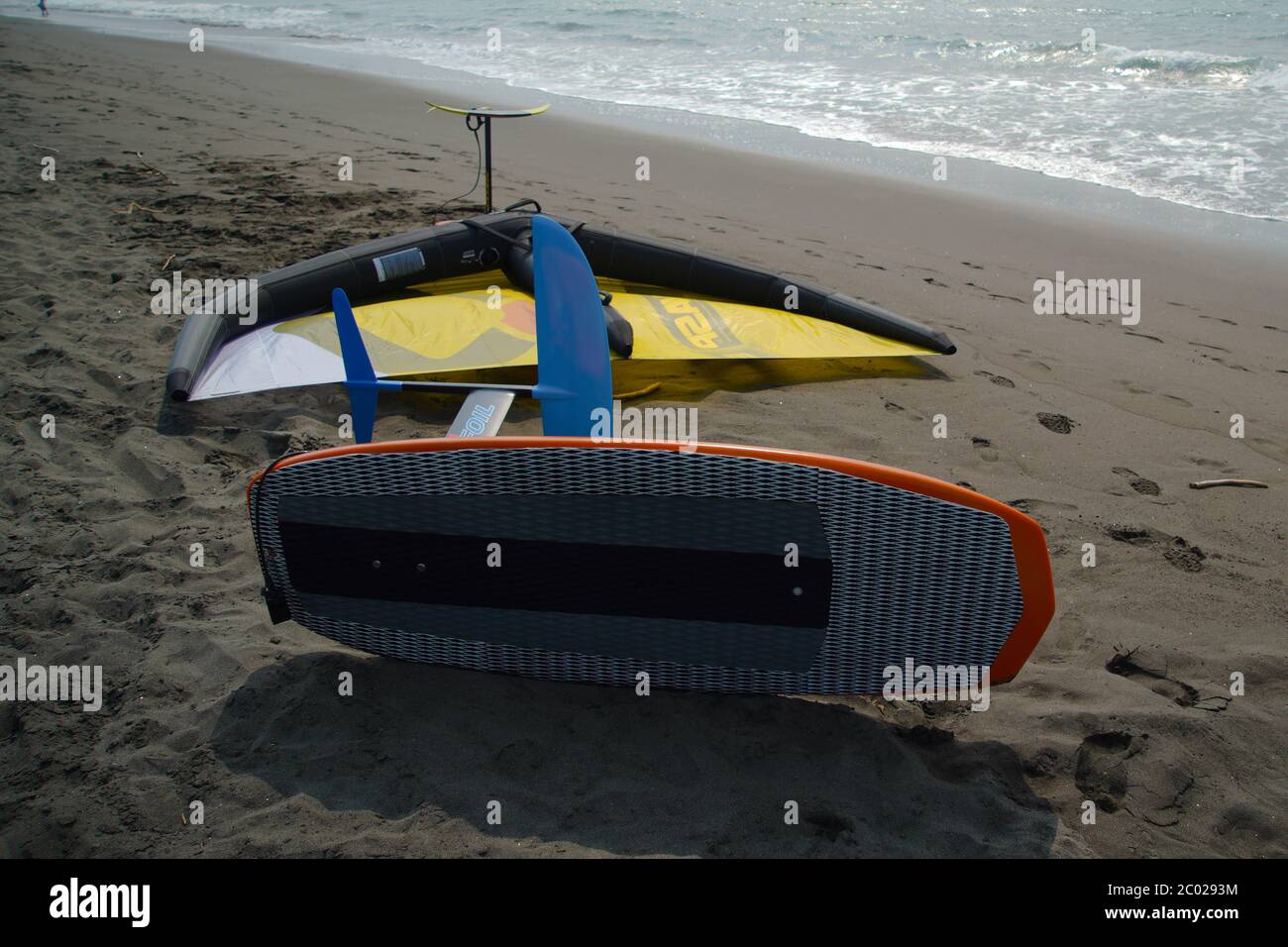 A hydrofoil paddleboard wing foil board on a beach. Paddleboard ...