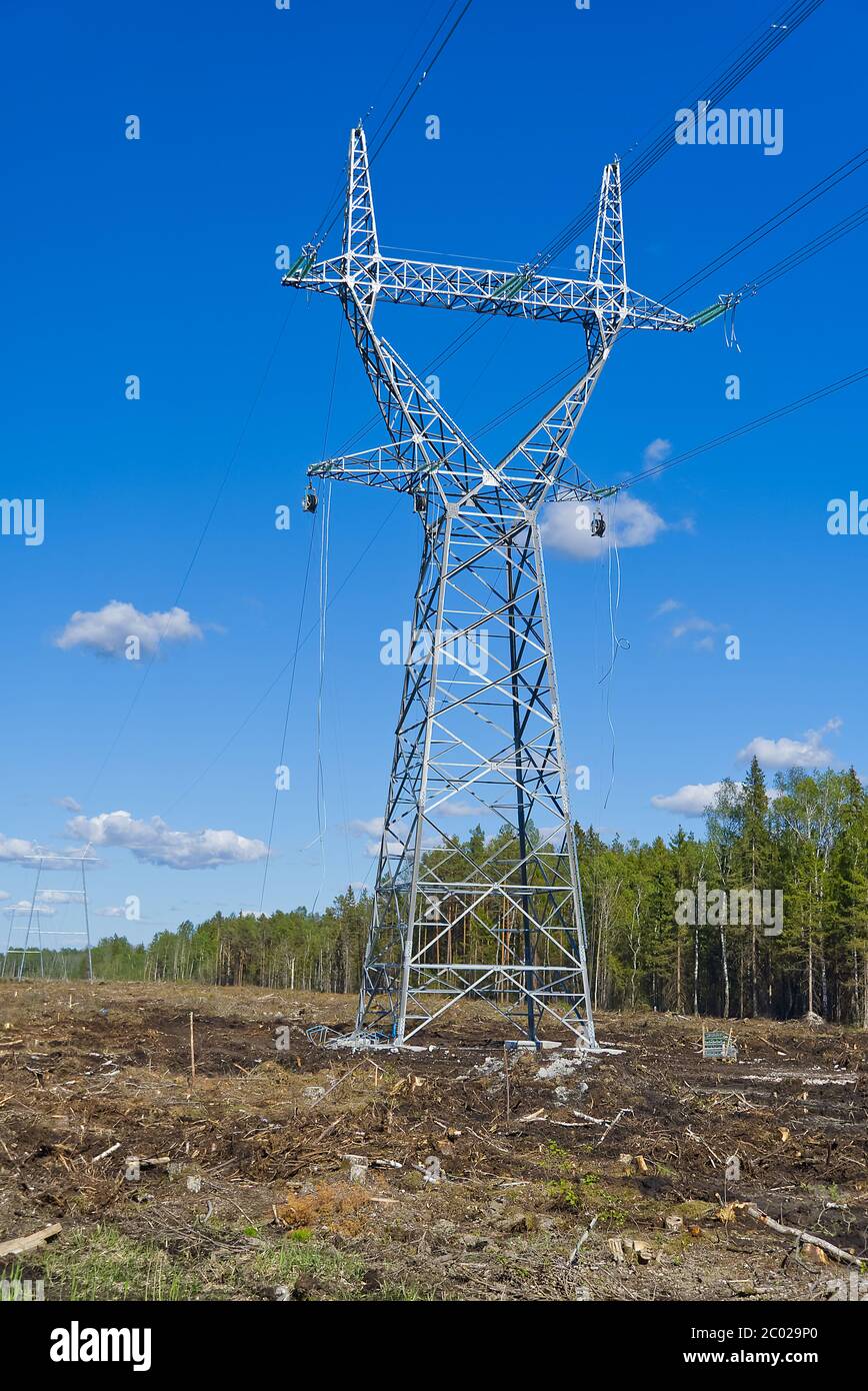 construction of new high voltage lines in forest. Estonia. new mast of ...