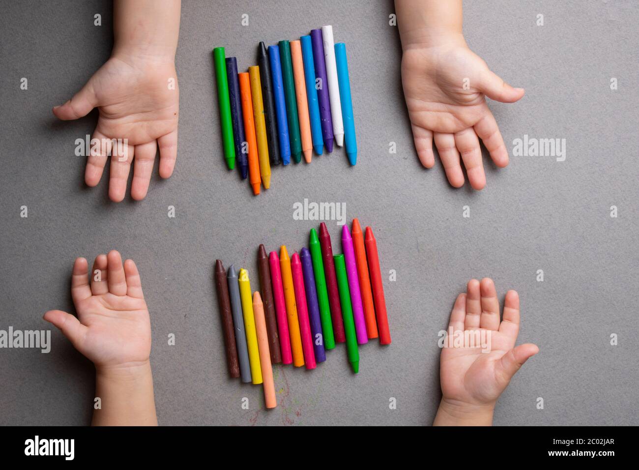 Hands coloring with crayons hi-res stock photography and images - Alamy