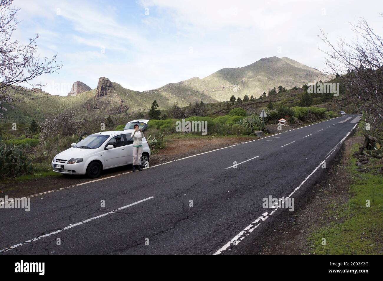 Woman photographed at the roadside Stock Photo - Alamy