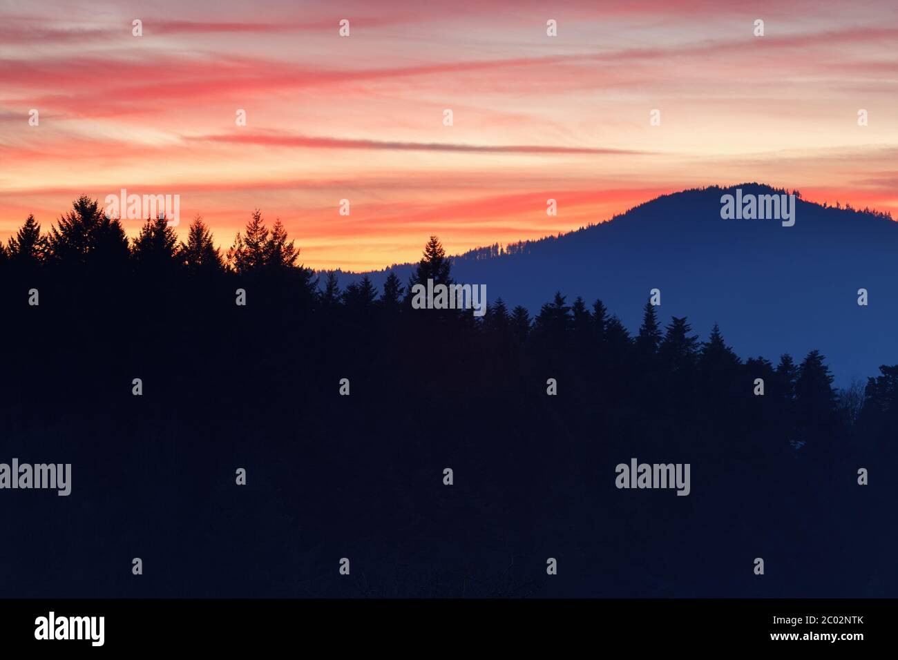 fire red sunset over mountains Stock Photo - Alamy