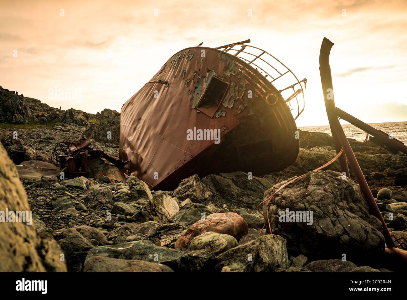 Shipwreck against the rocks along the norwegian fjord in Northern ...