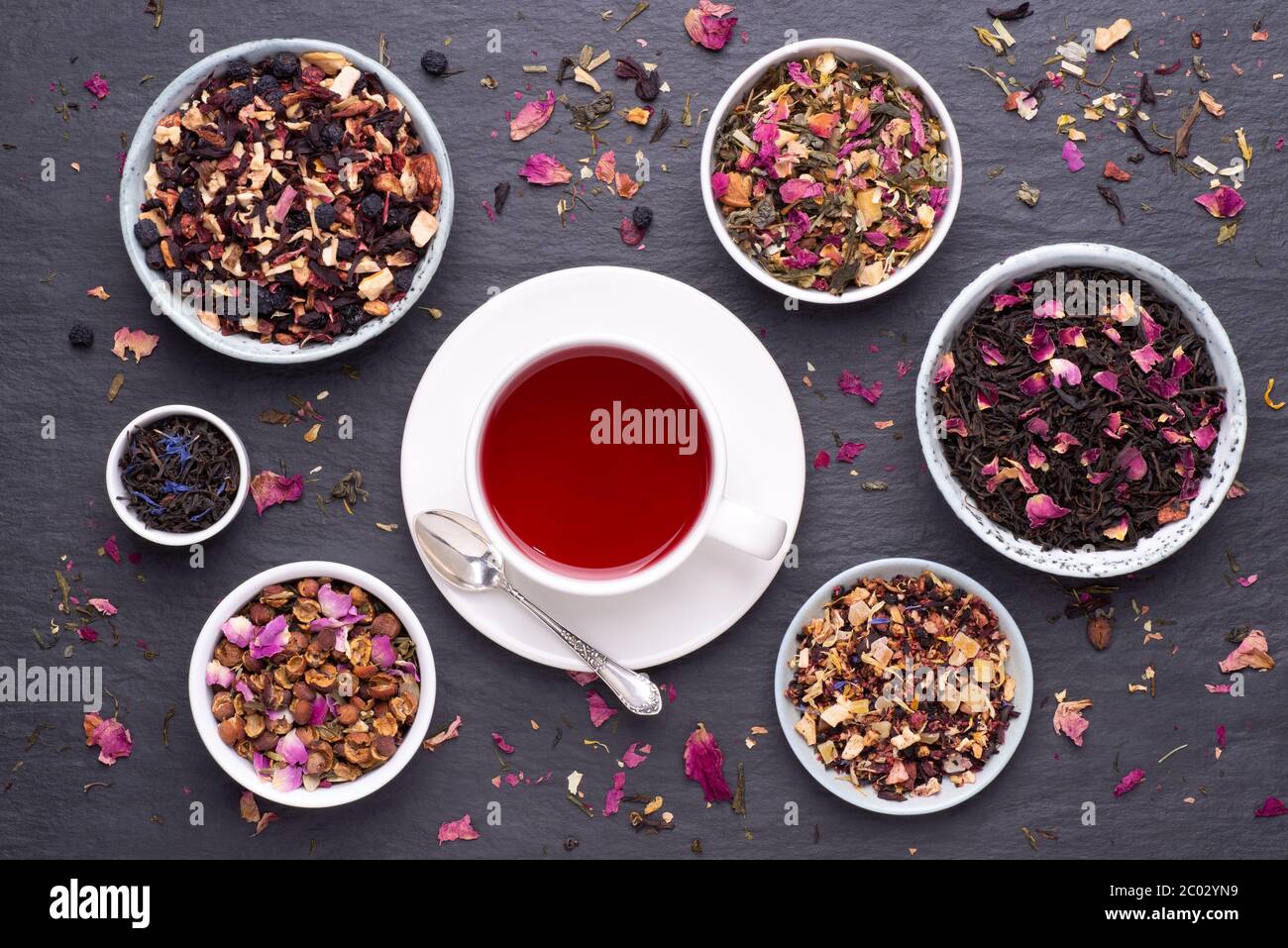 Cup of fruit tea on dark, stone background, top view Stock Photo - Alamy