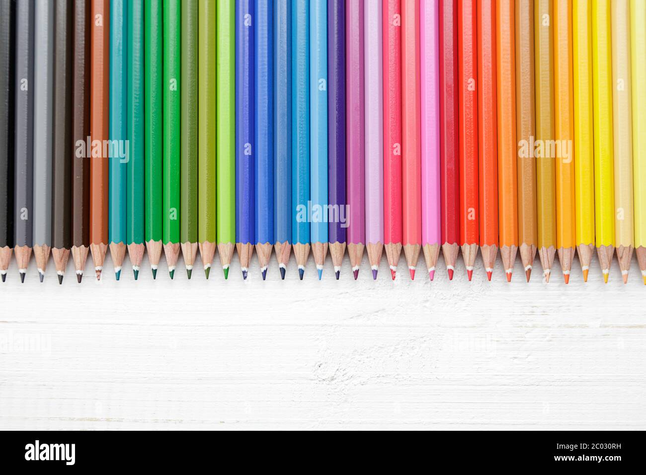 Row of several colored pencils on a wooden old white wooden table Stock ...