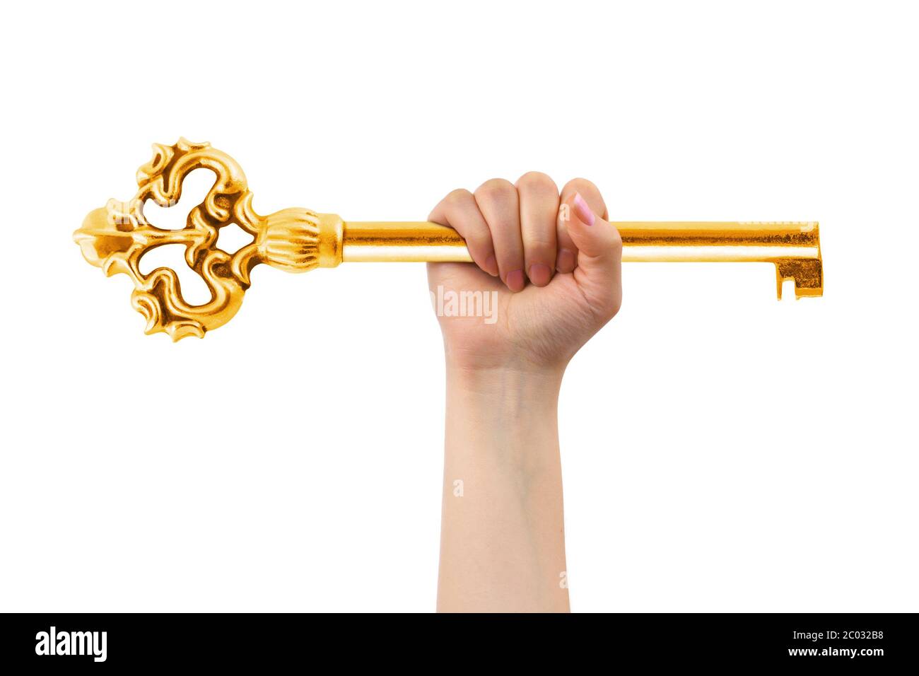 Hand and big gold key Stock Photo - Alamy