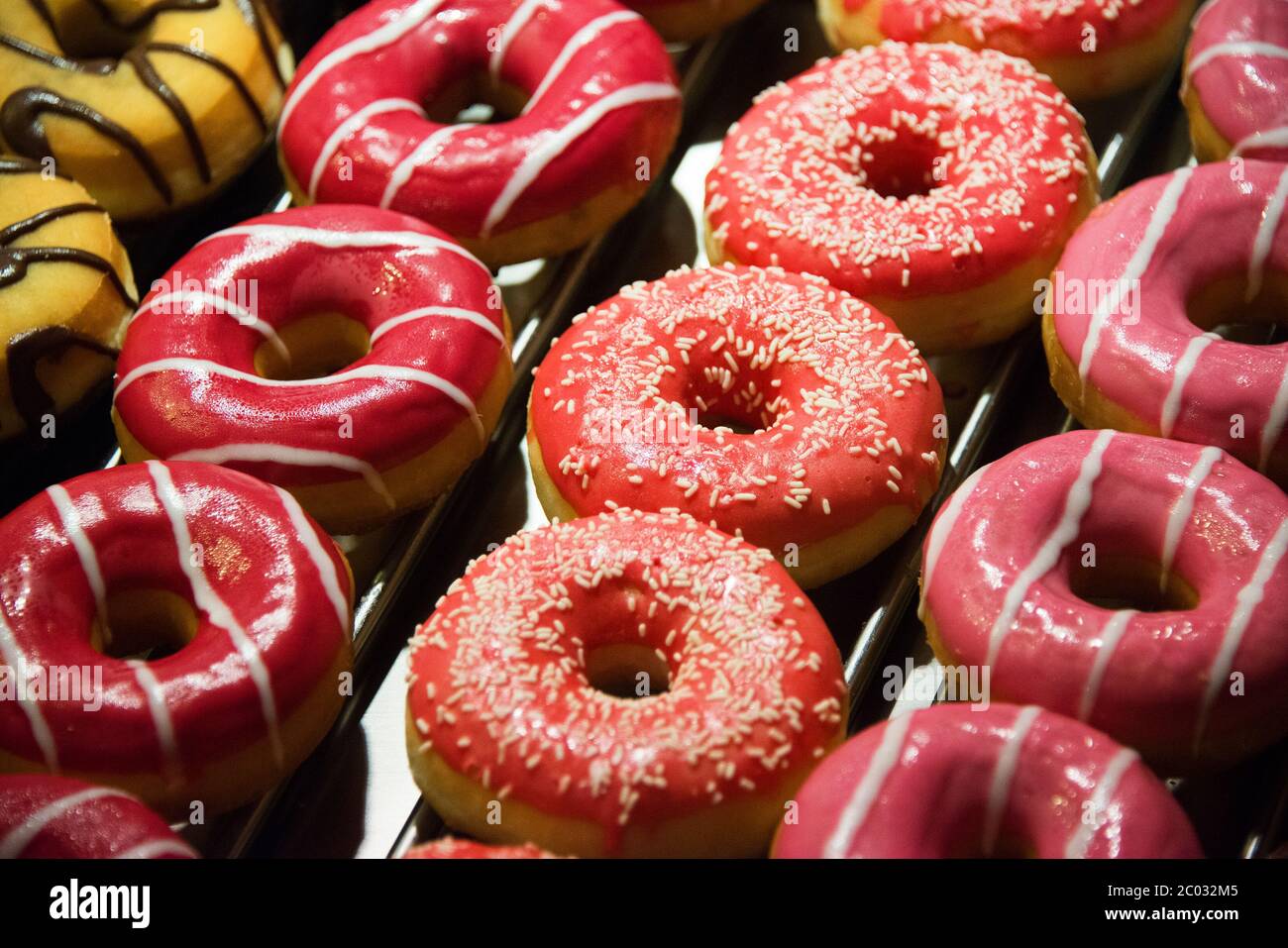 Sweet donuts arranged at display Stock Photo - Alamy