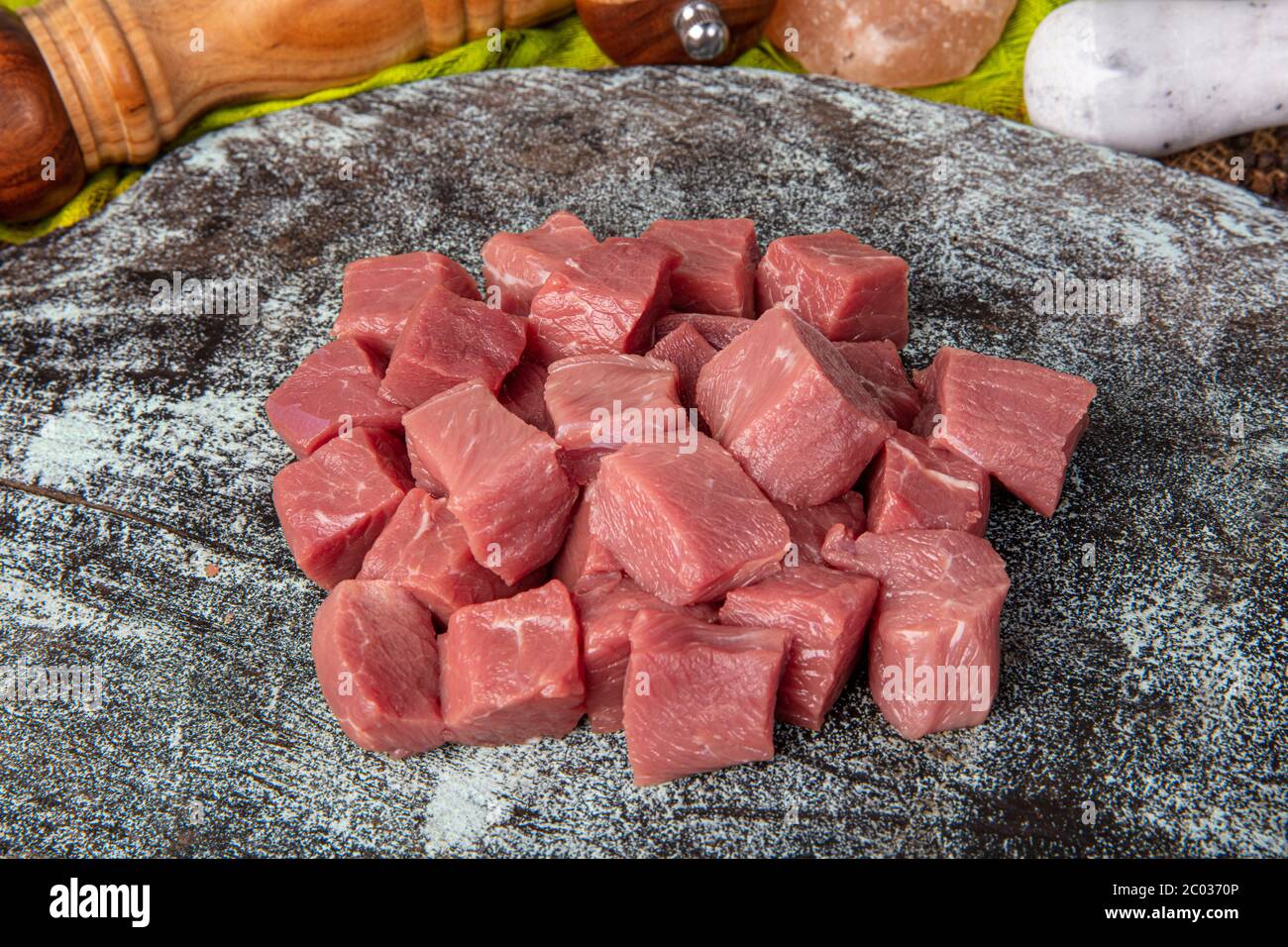 Diced beef on wooden background with space. Raw lean diced casserole ...