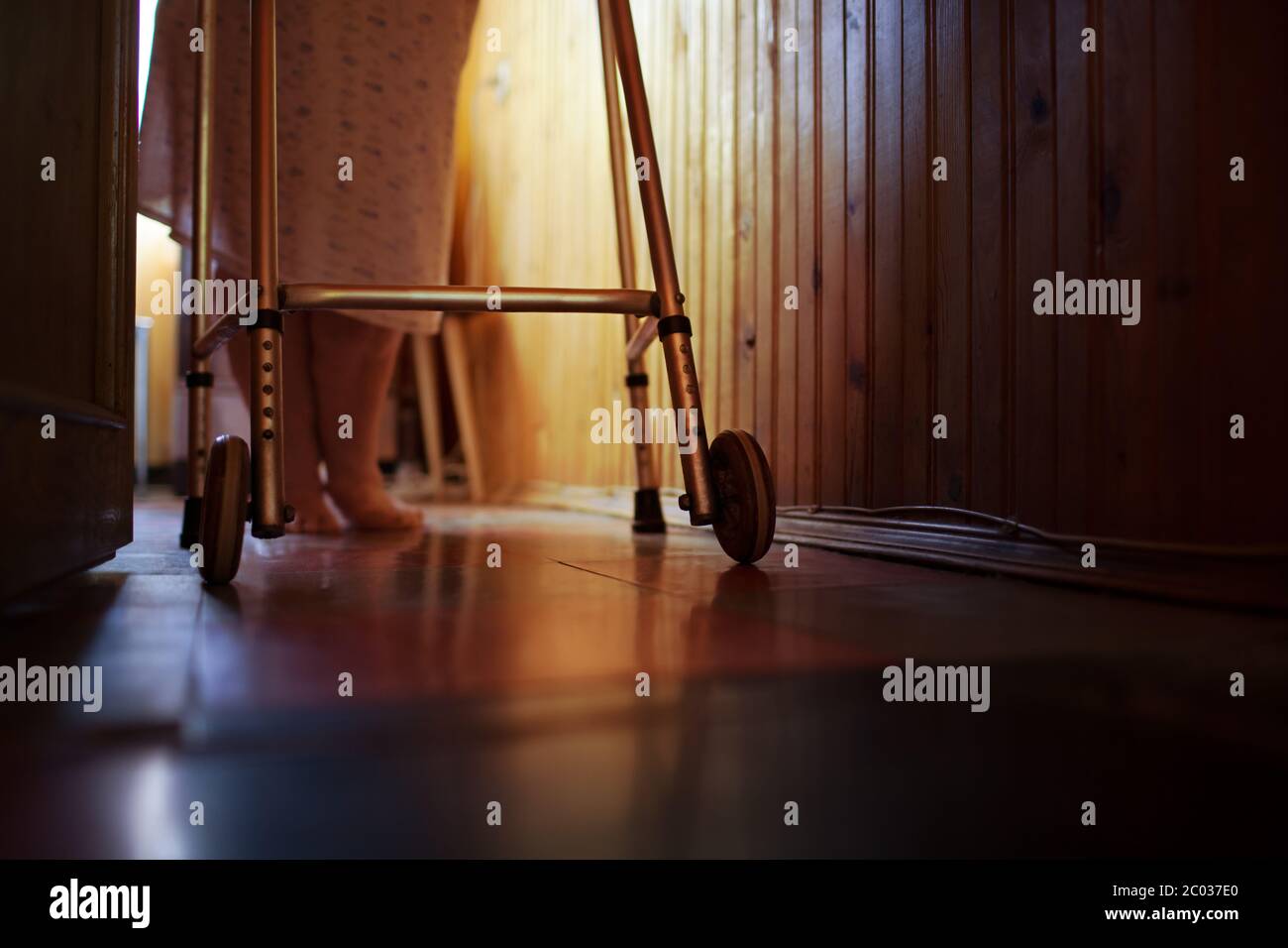 Senior woman using walker at home Stock Photo - Alamy