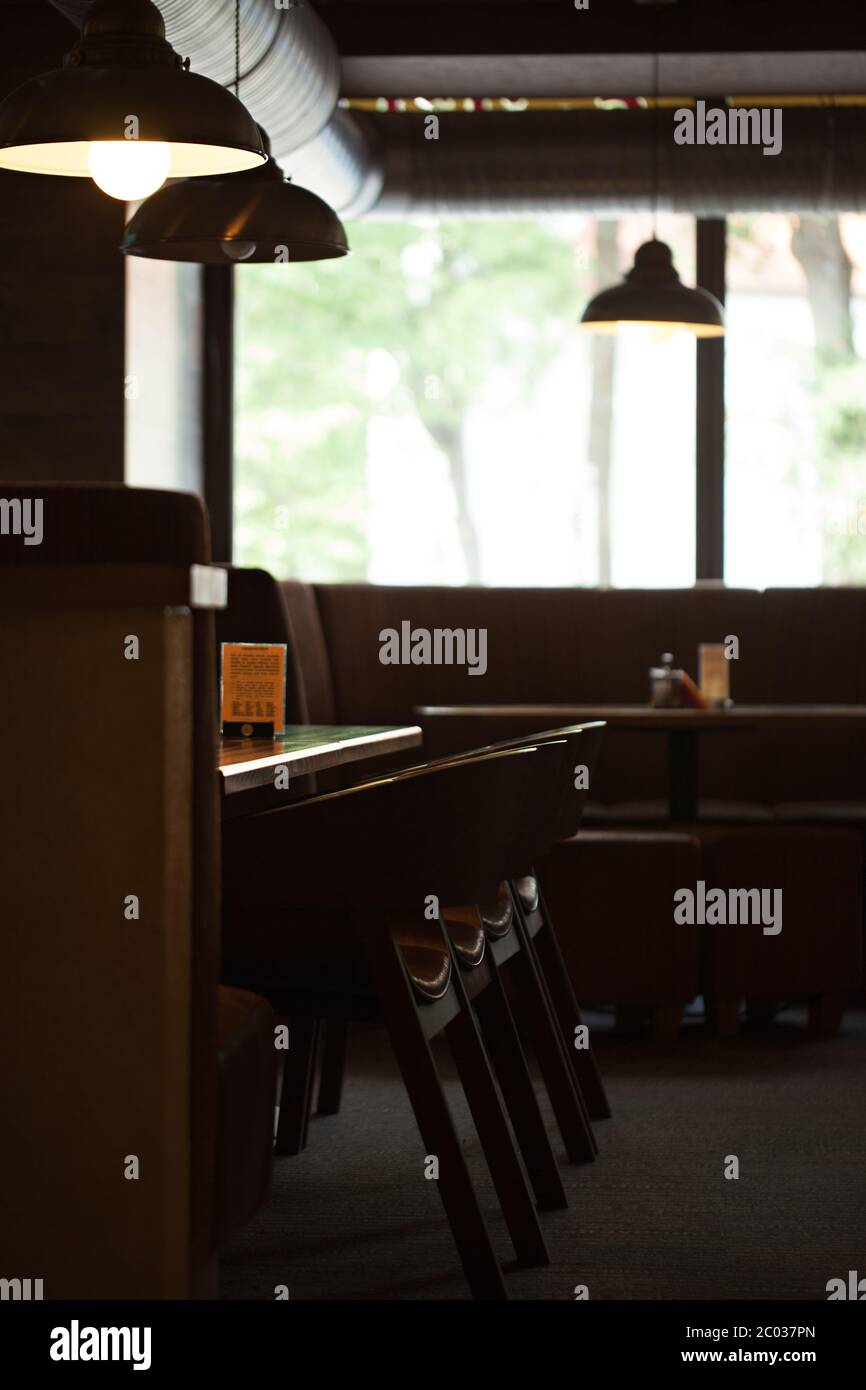 Empty cafe interior with wooden furniture and sofa Stock Photo - Alamy