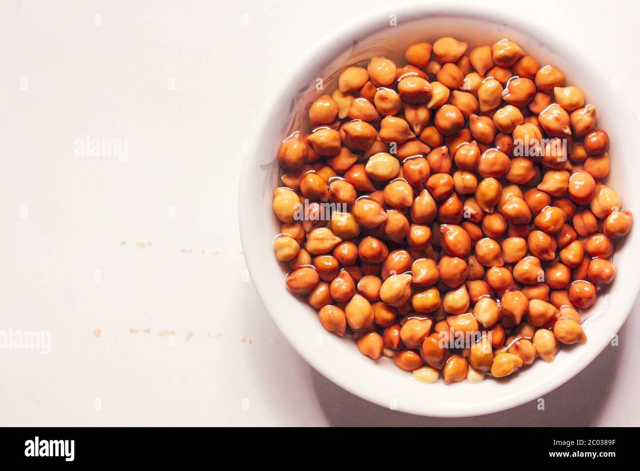 Pulsess on white bowl, healthy food Stock Photo - Alamy