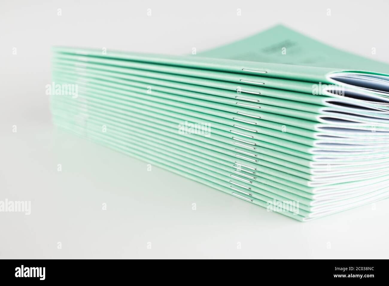stack of thin student notebooks for elementary school Stock Photo - Alamy