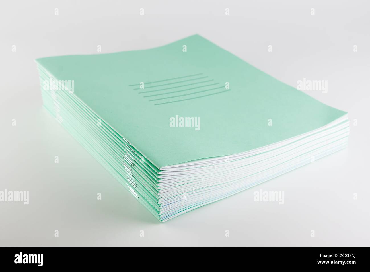 stack of thin student notebooks for elementary school Stock Photo - Alamy