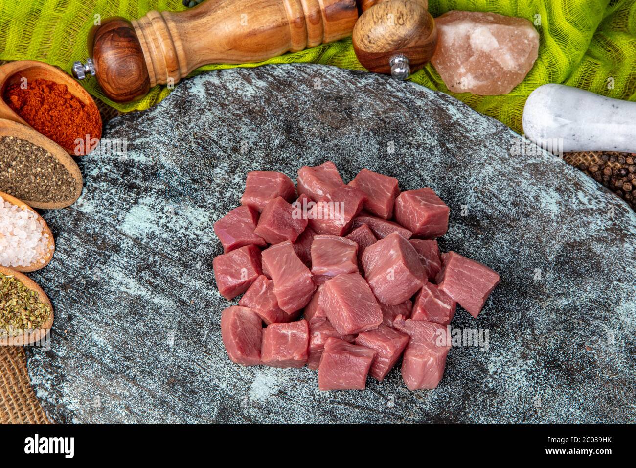 Diced beef on wooden background with space. Raw lean diced casserole ...