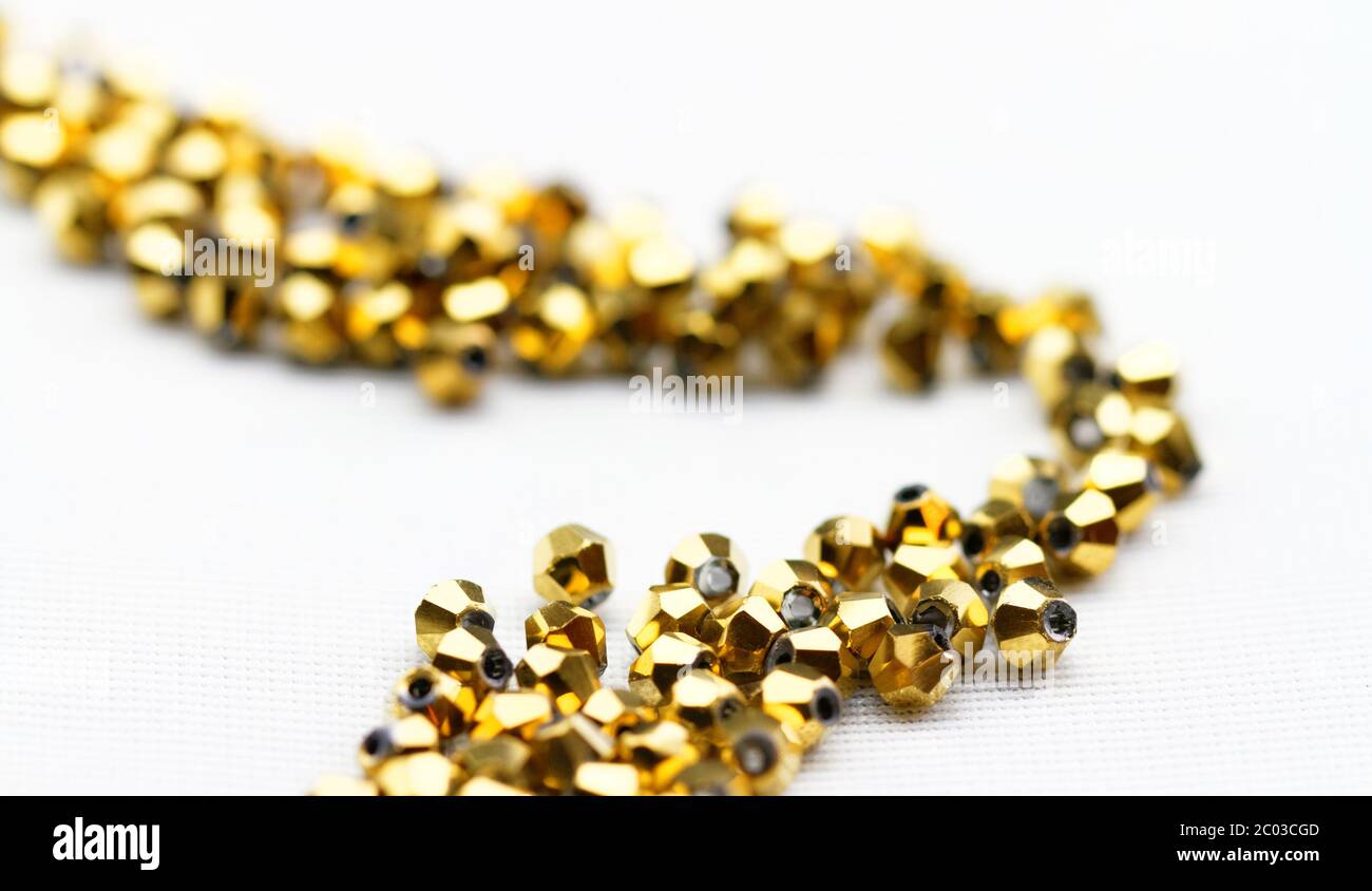 Beautiful golden glass beads closeup on white background Stock Photo ...