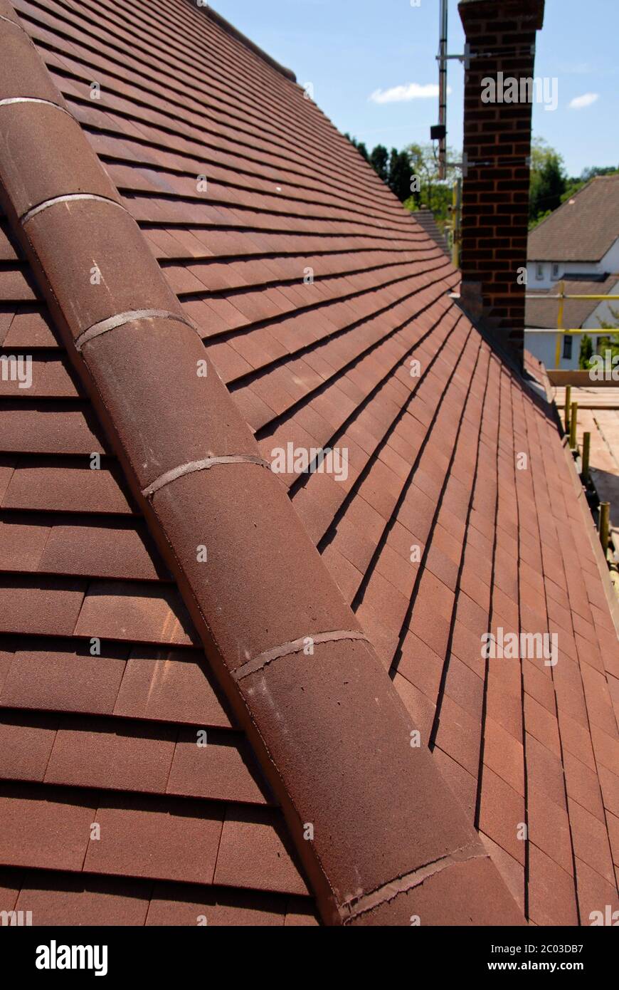 Covered corner of domestic house roof during re-roofing process, Kent ...