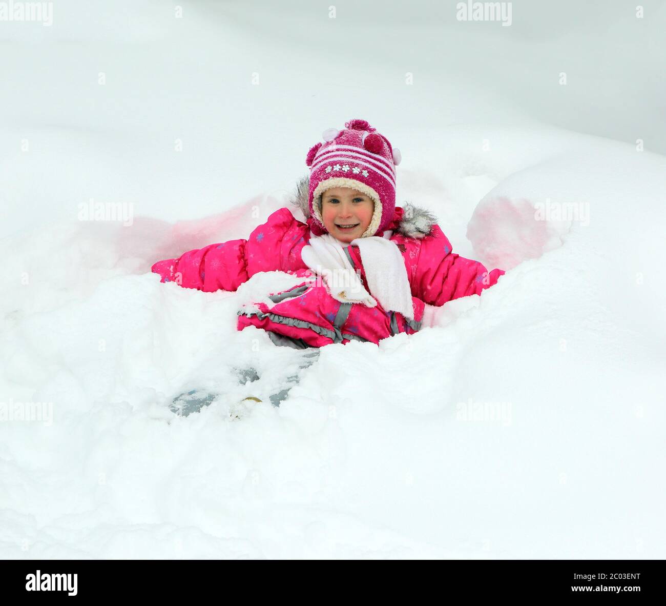 happy little girl in snow Stock Photo - Alamy