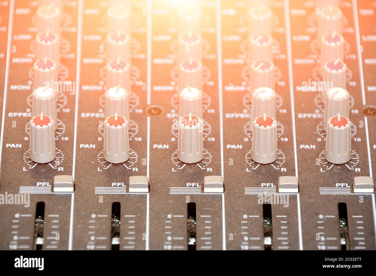 DJ mixer. illuminated from behind by the light of a spotlight Stock ...