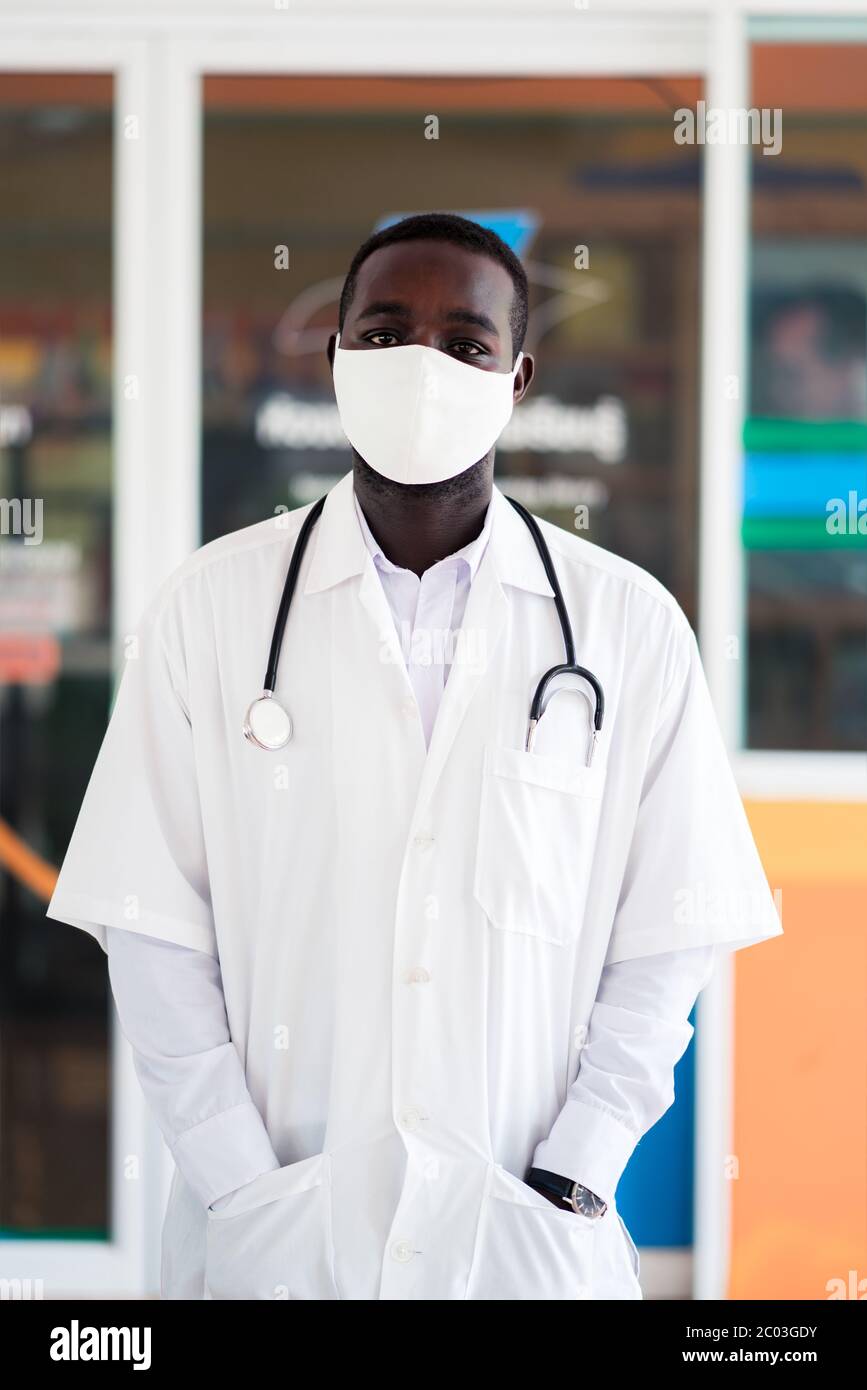 African doctor wear face mask and holding stethoscope Stock Photo - Alamy