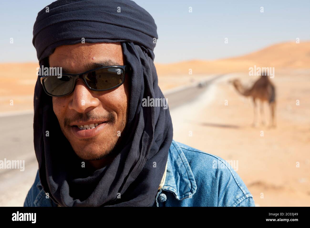Berber tribesman with his camel in the Sahara desert, North Africa ...