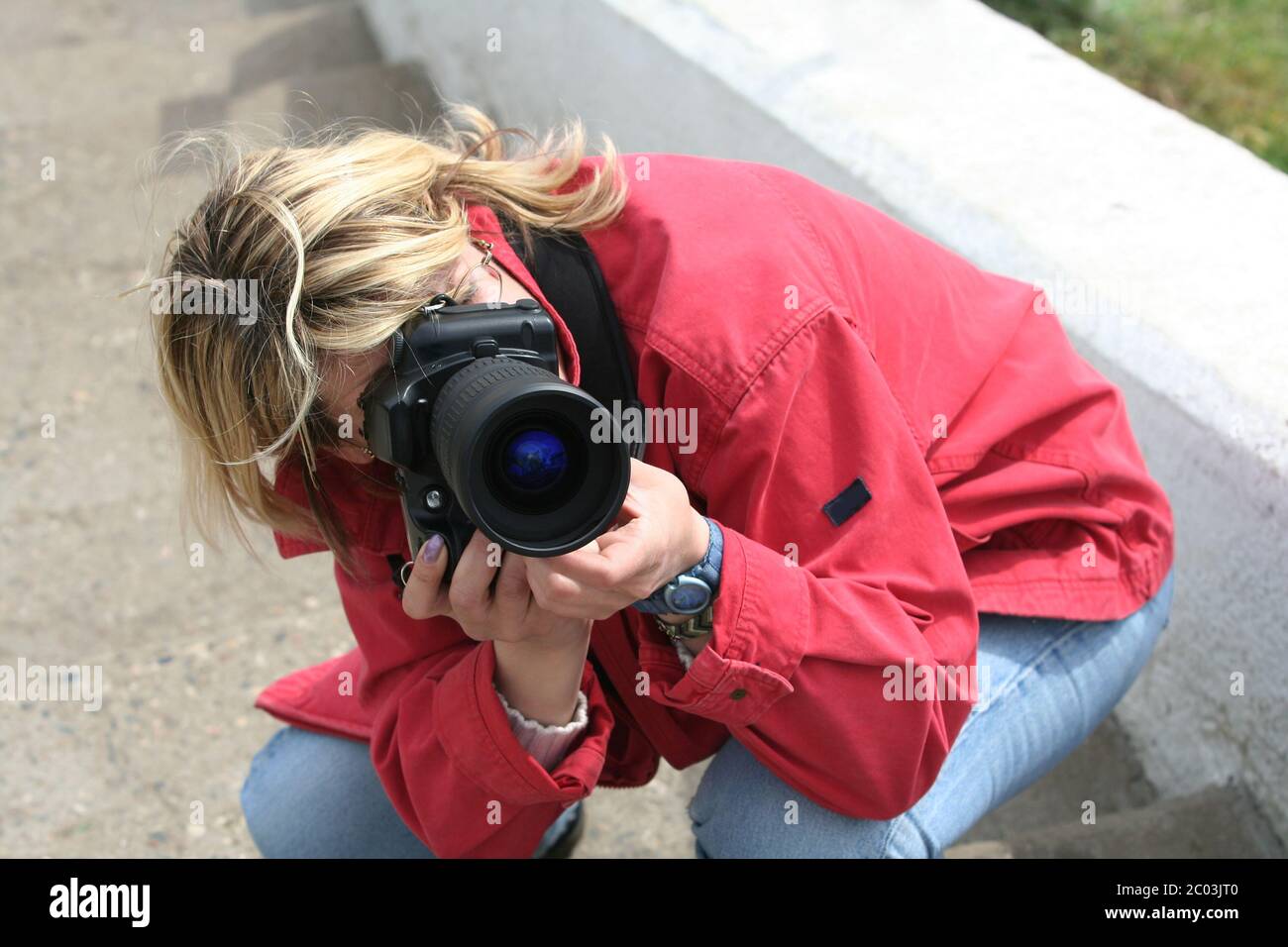 The photographer-woman with camera at work Stock Photo - Alamy