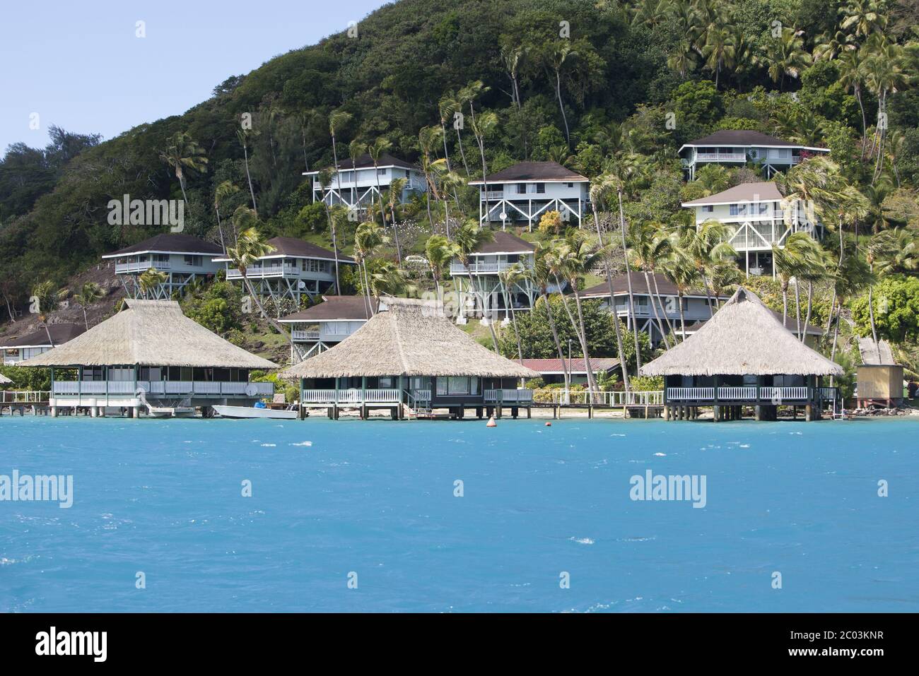 Hill slope by the sea and lodges on a slope Stock Photo - Alamy