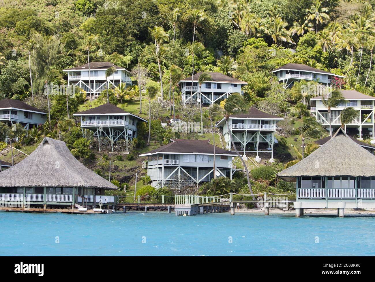 Hill slope by the sea and lodges on a slope Stock Photo - Alamy