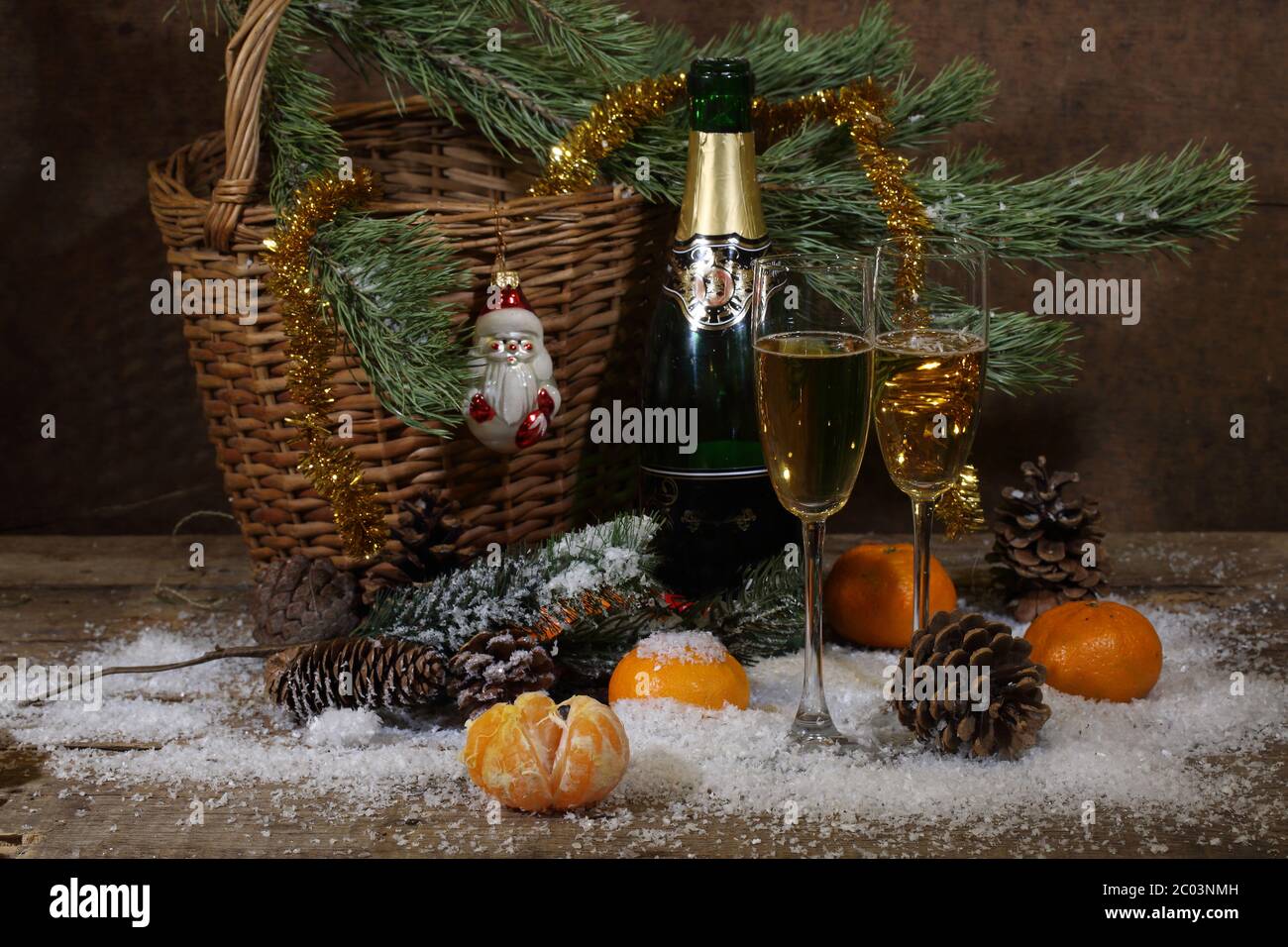 Champagne, tangerines and fur-tree branch with con Stock Photo - Alamy