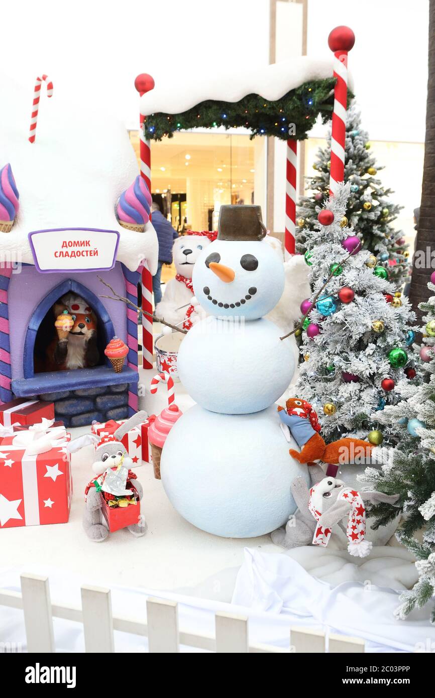 Snowman in New Year's small town, scenery Stock Photo - Alamy