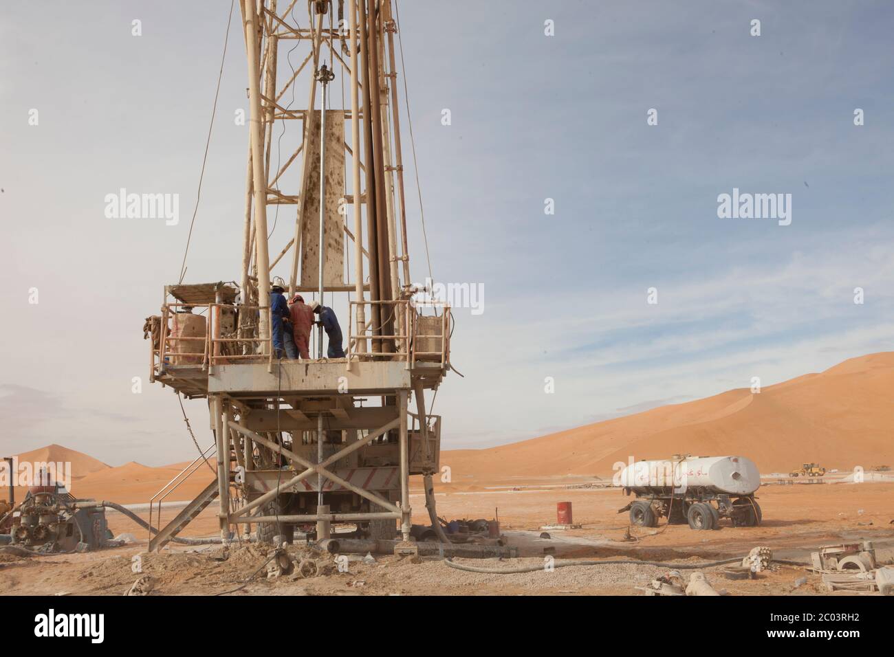 An oil company rig drilling for water, Sahara desert Stock Photo - Alamy