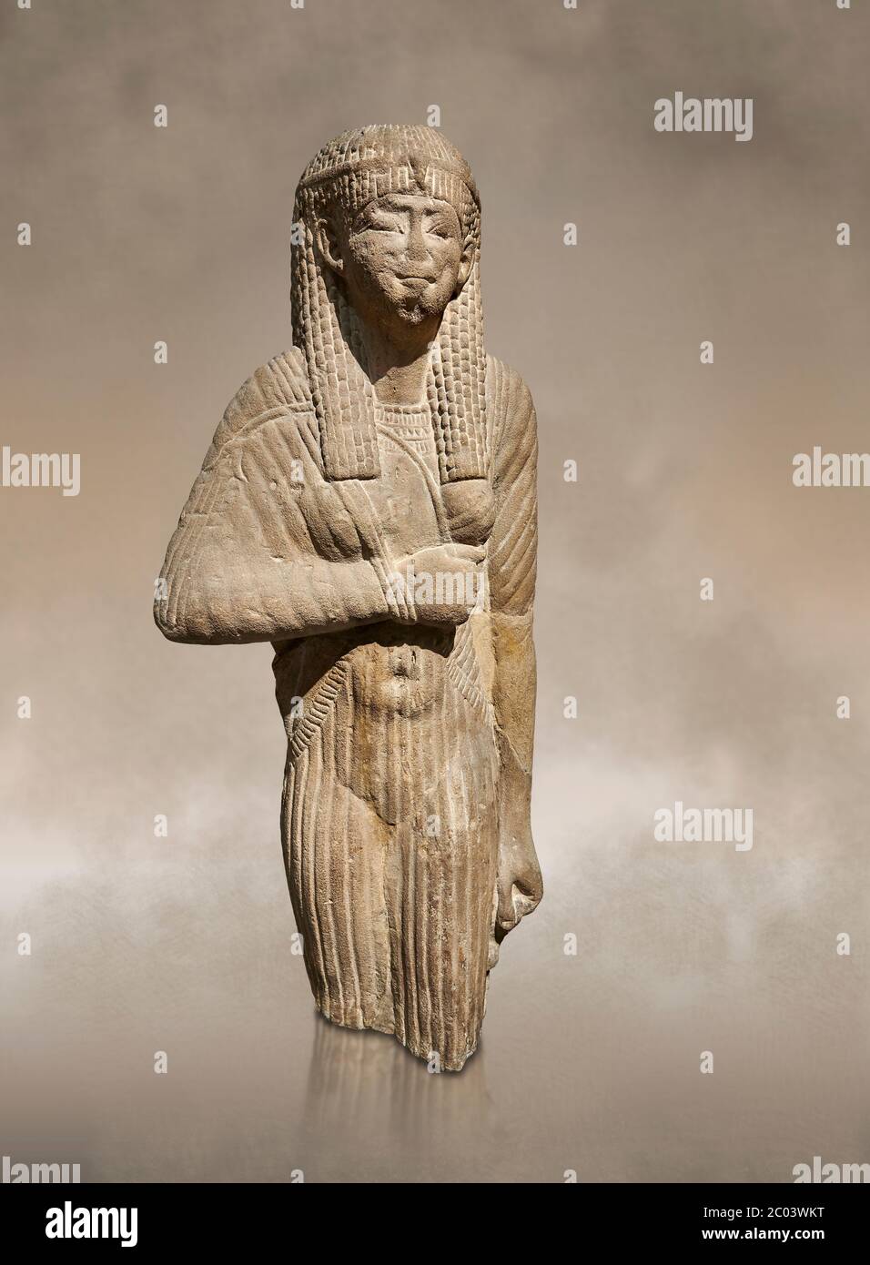 Ancient Egyptian statue of a queen wearing a clinging dress, sandstone ...