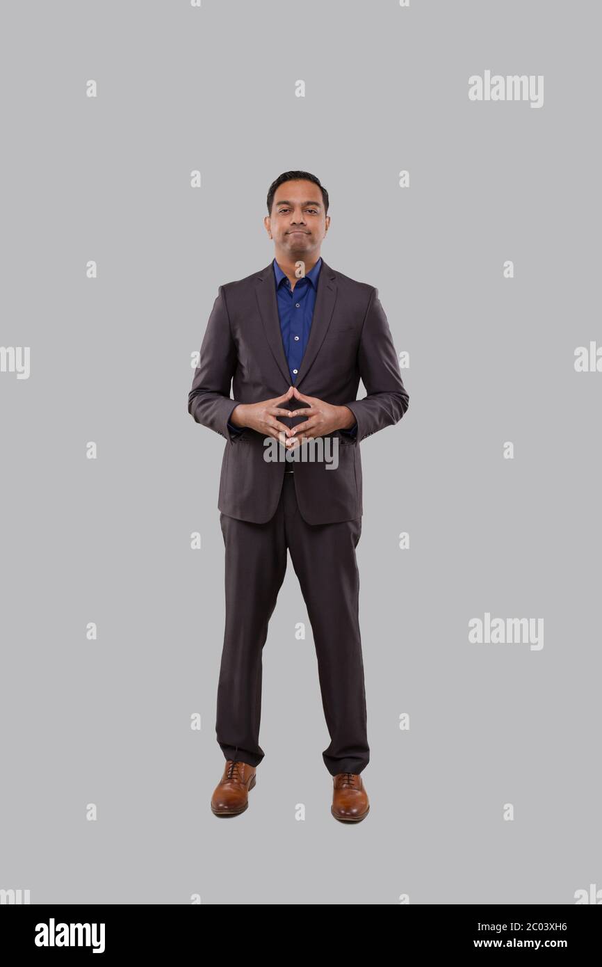 Businessman Smilling Hands in Front of Chest Isolated. Indian ...