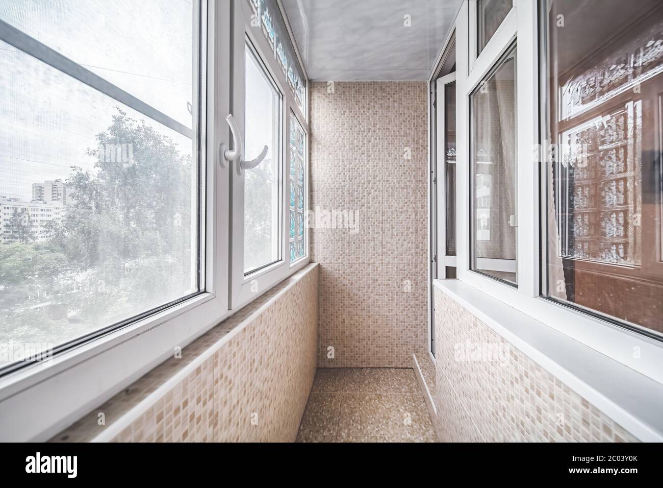 Small old common open balcony interior in high residential apartment ...