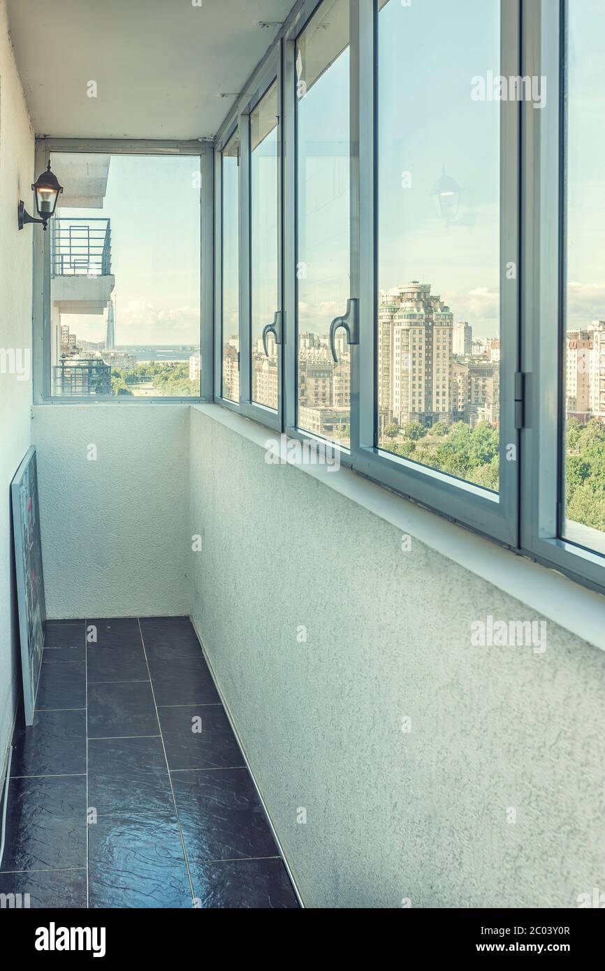 Small old common open balcony interior in high residential apartment ...