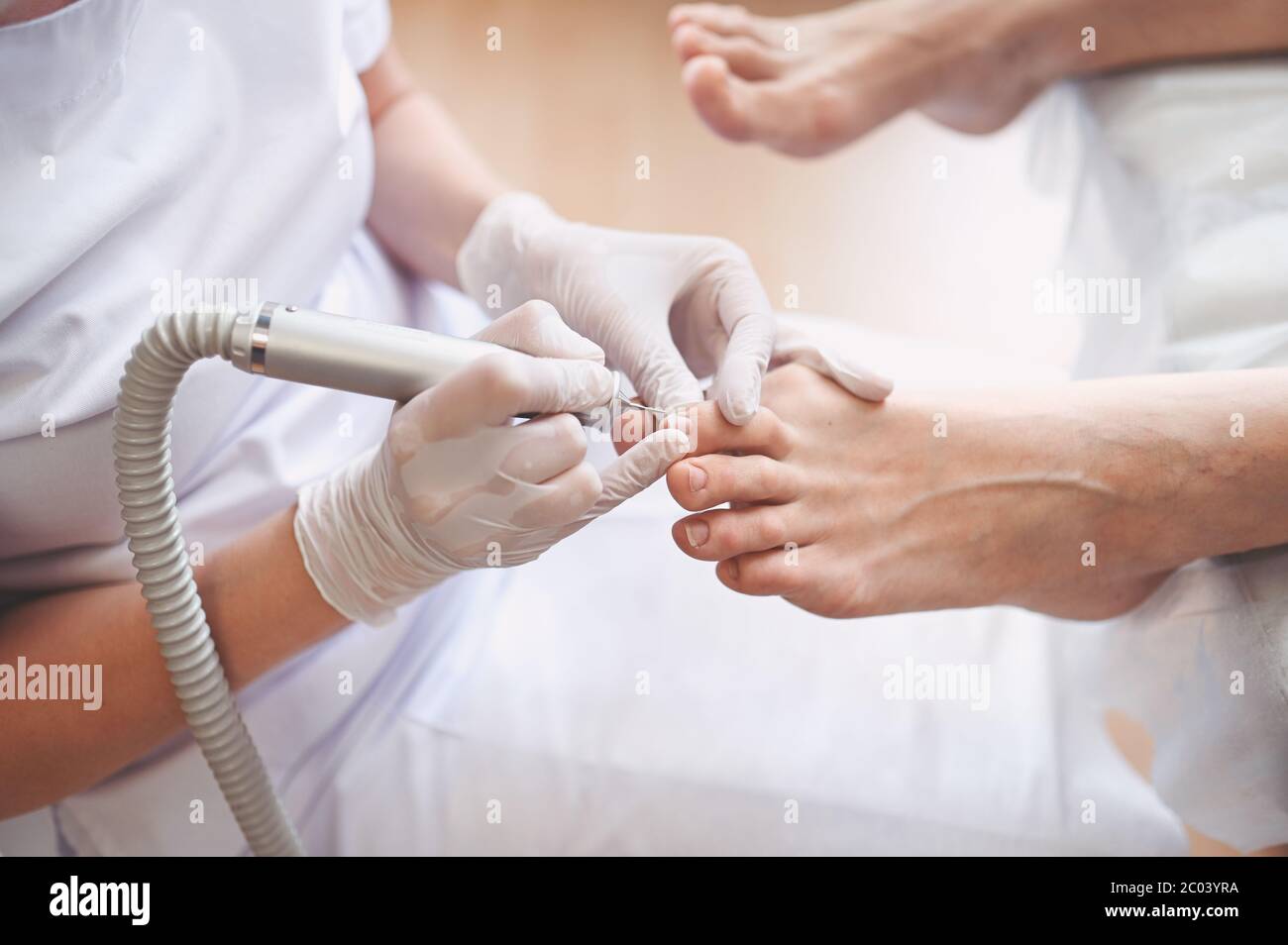 Hardware medical pedicure with nail file drill apparatus. Patient on ...