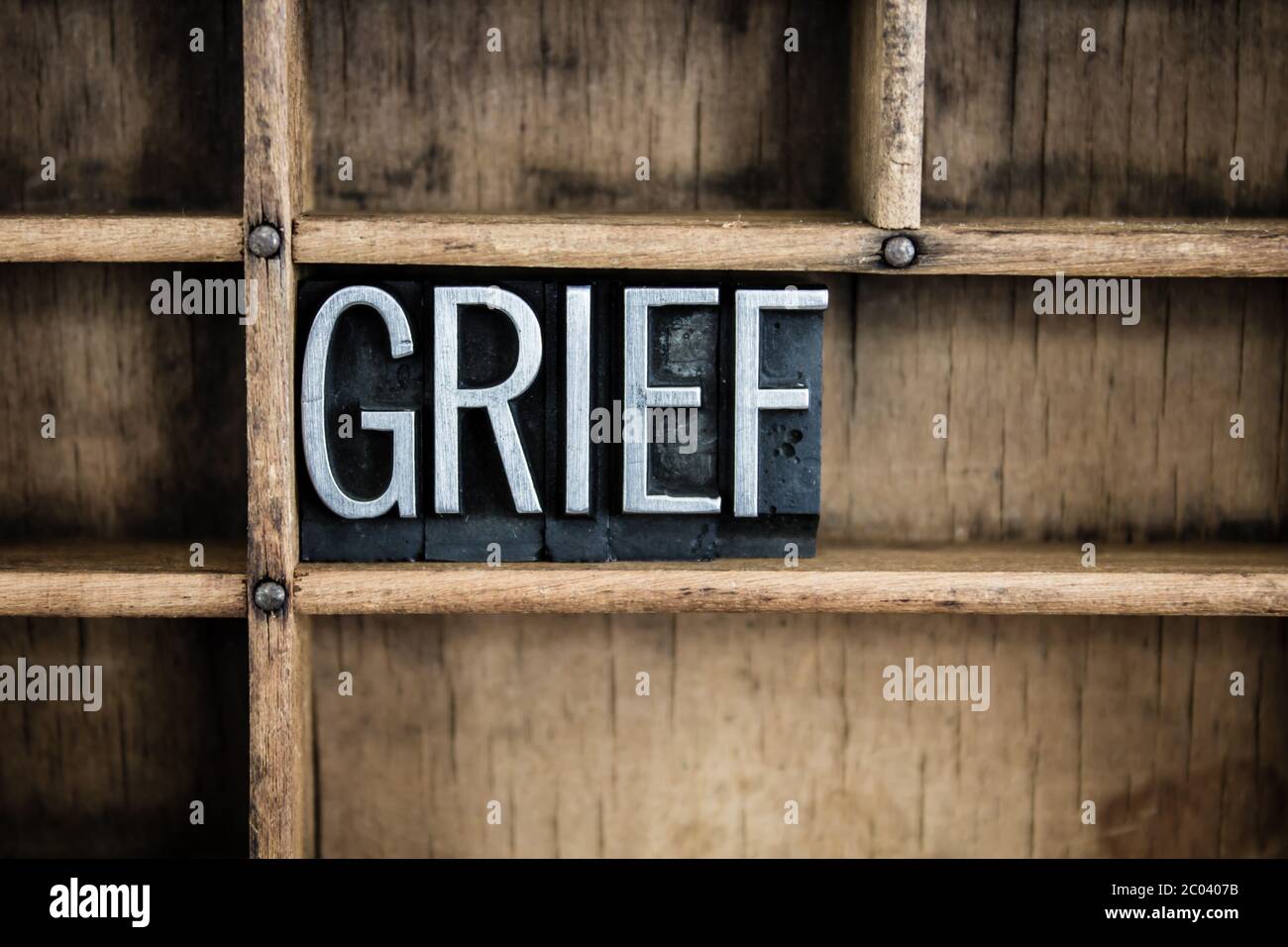 Grief Concept Metal Letterpress Word in Drawer Stock Photo - Alamy