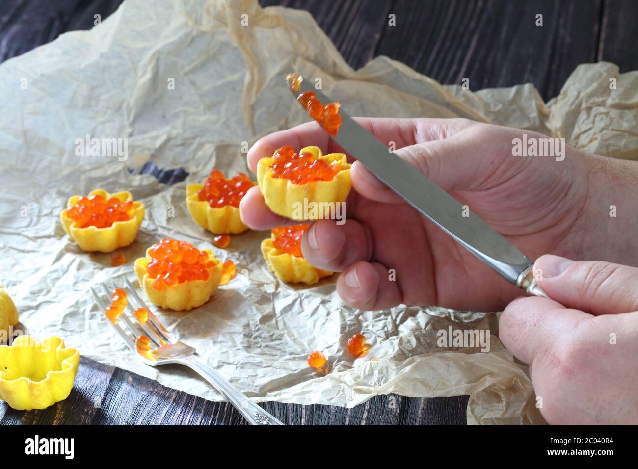 Red caviar hand hi-res stock photography and images - Alamy