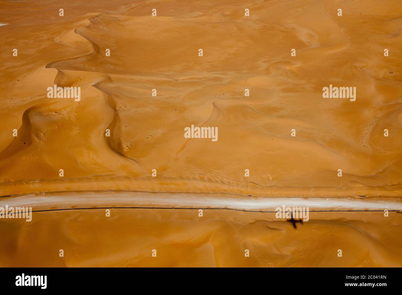A line of pipes welded for an oil company in the Sahara desert to ...