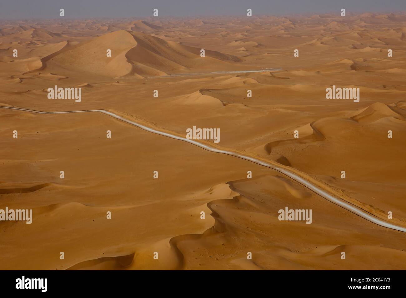 A line of pipes welded for an oil company in the Sahara desert to ...