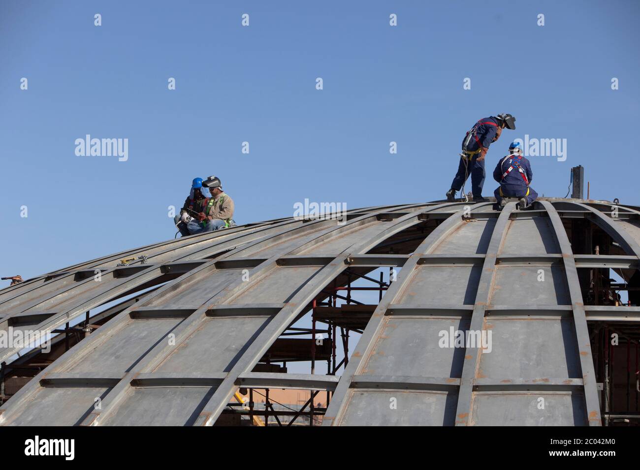 A welder prepare to attach steel plates to a pressure vessel at a new ...