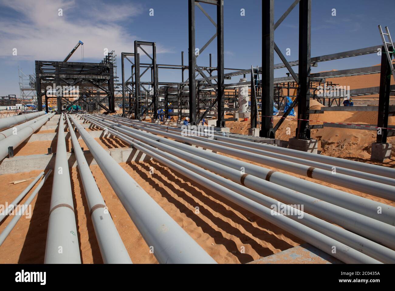 Pipe runs begin to take shape In the construction of a new oil facility ...