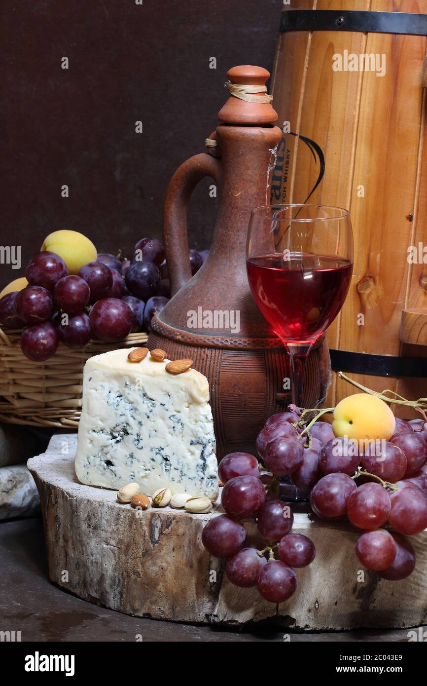 Wine, fruit, nuts and cheese Stock Photo - Alamy