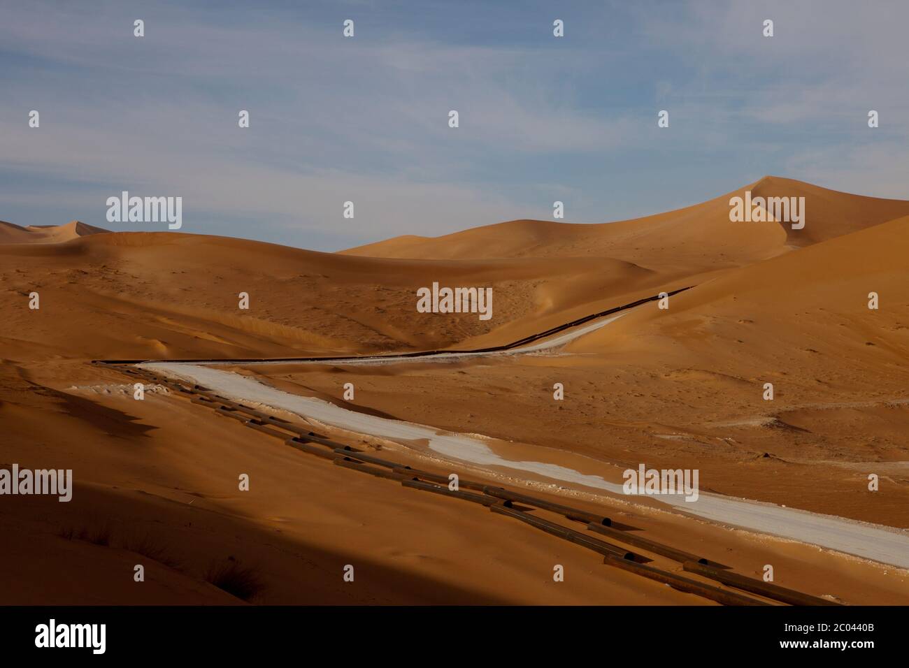 A line of pipes positioned ready for welding for an oil company in the ...