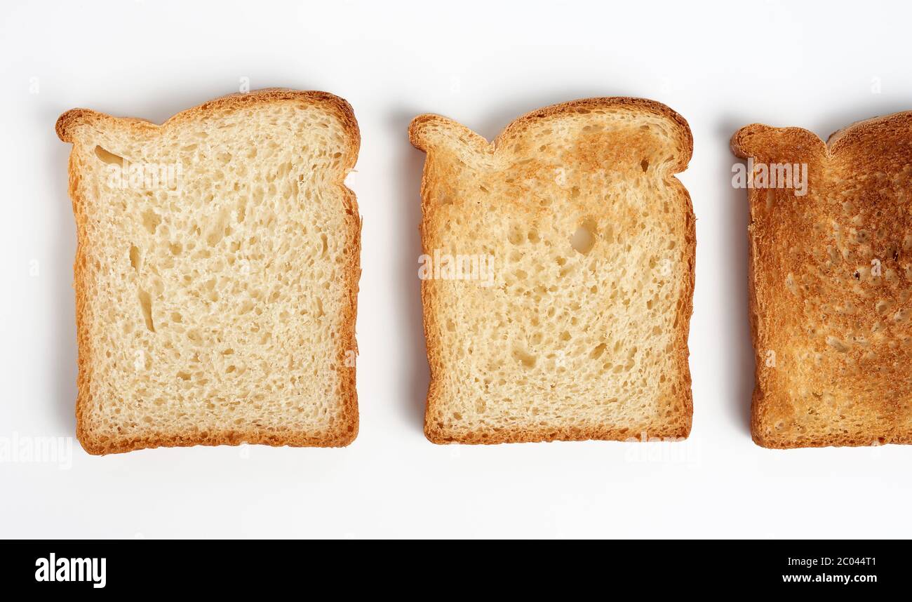 square slices of bread made from white wheat flour toasted in toaster ...