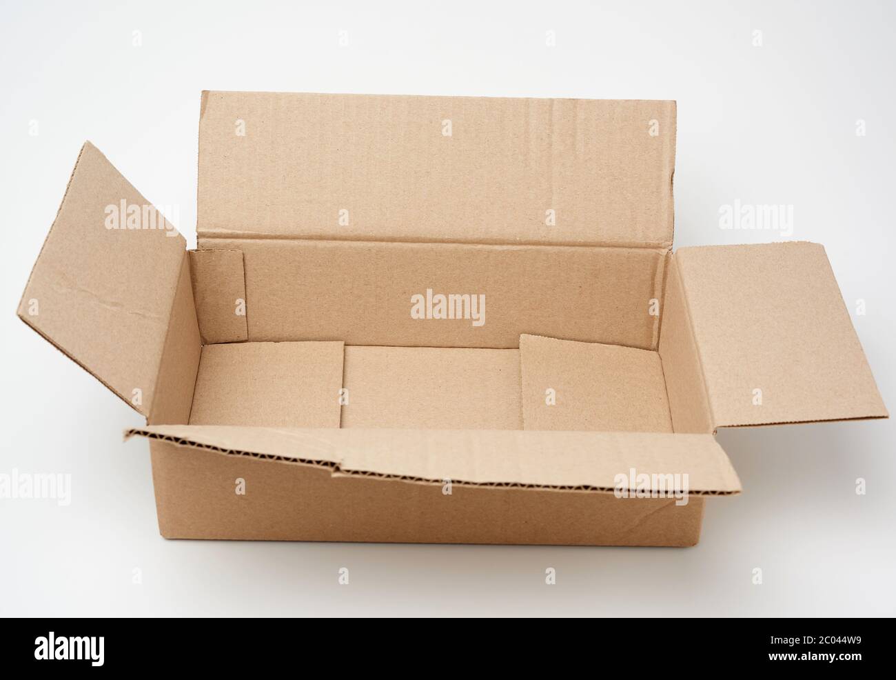 open empty rectangular box made of brown corrugated cardboard on a ...