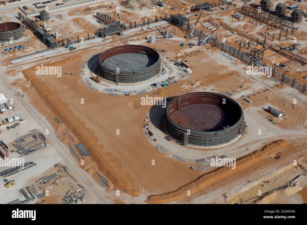 Oil tanks under construction seen from the air at a new oil facility in ...