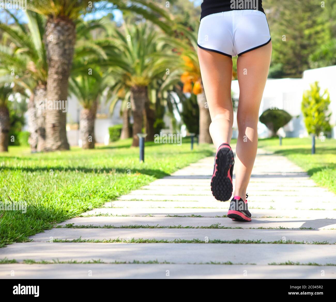 Runner feet running on road closeup on shoes Stock Photo - Alamy