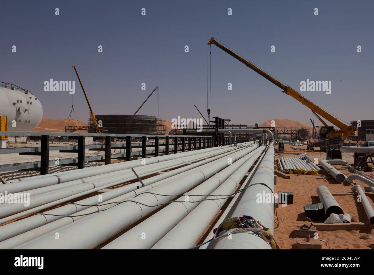 Pipe runs begin to take shape In the construction of a new oil facility ...