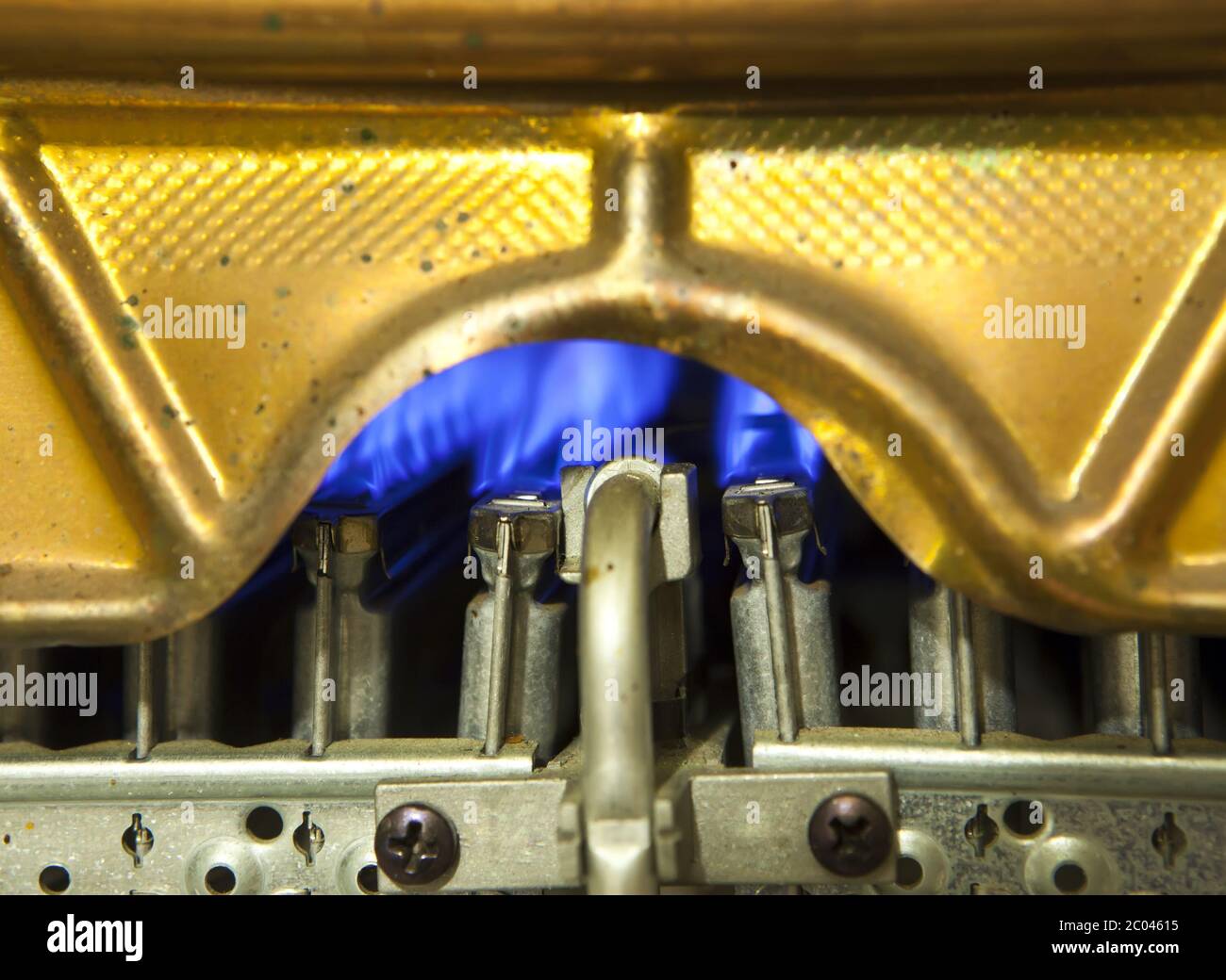 Element of ignition of the gas water heater Stock Photo - Alamy