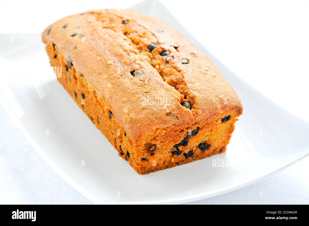 Plum cake with cocoa, apple and fruit and nuts Stock Photo - Alamy